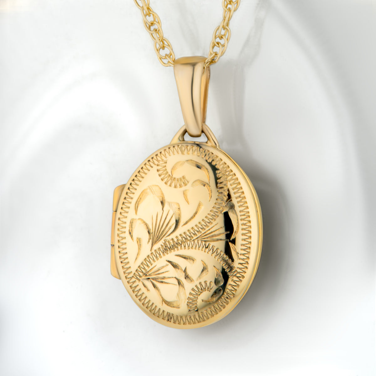 Gold Oval Engraved Locket – The Locket Tree